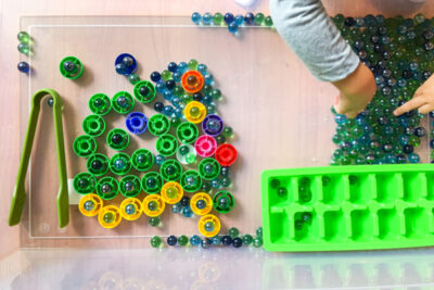Caps & Marbles Balancing Game - Happy Toddler Playtime