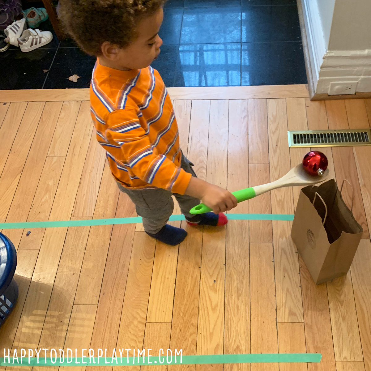 Christmas Ornament Balance Race - Happy Toddler Playtime
