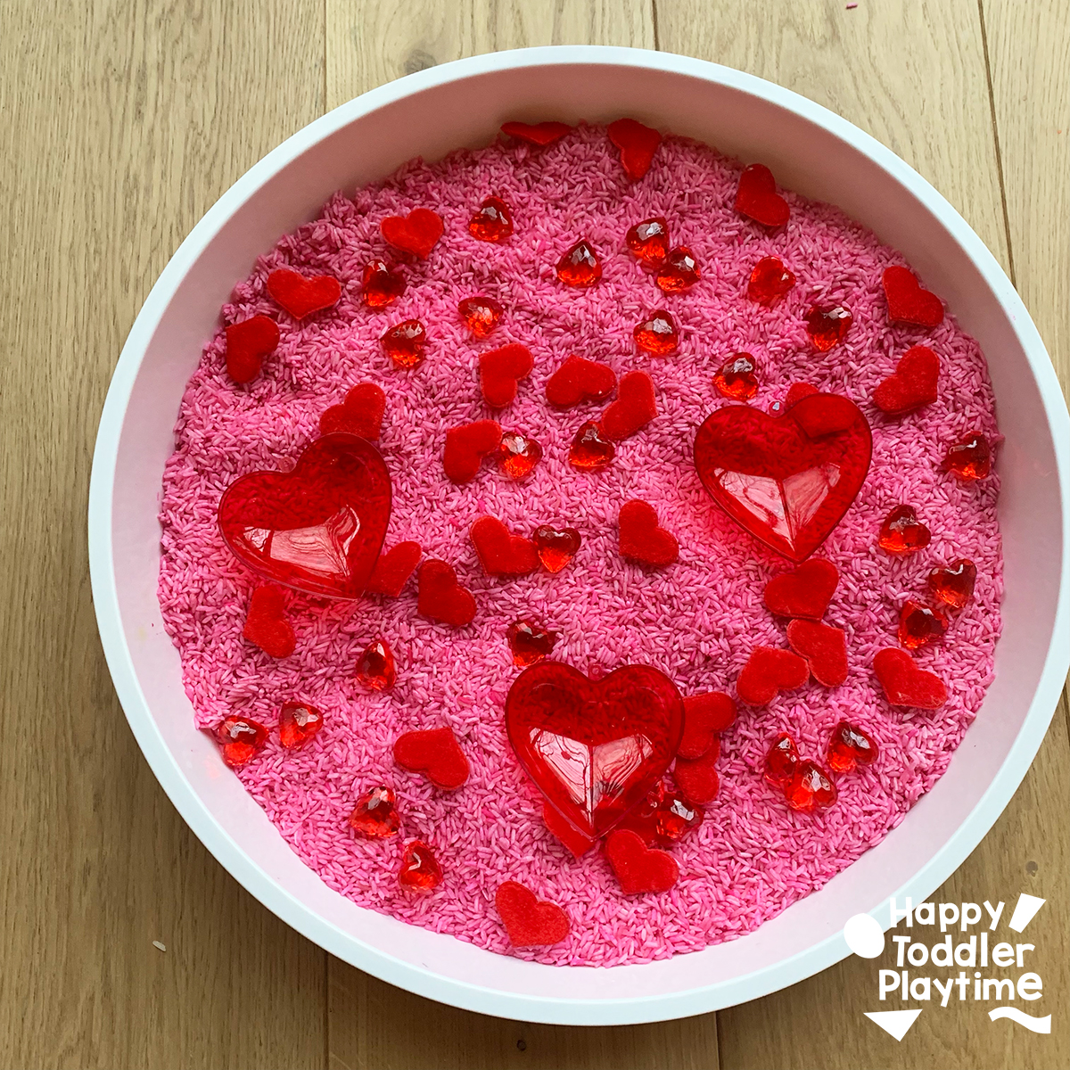 Valentine's Day Sensory Bin: Hearts and Gems - Happy Toddler Playtime