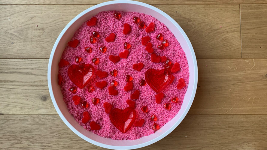 Valentine's Day Sensory Bin: Hearts and Gems - Happy Toddler Playtime