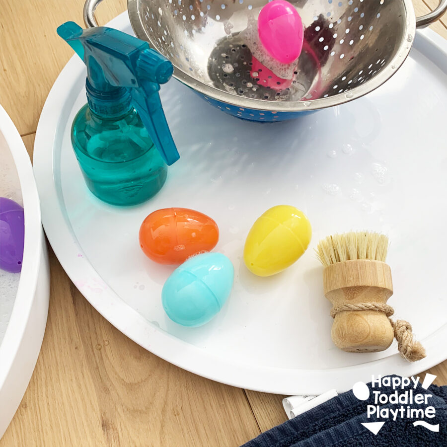 Wash the Easter Eggs Sensory Bin - Happy Toddler Playtime