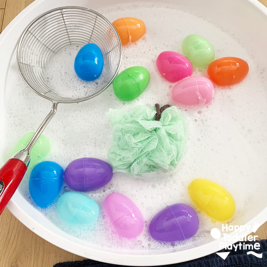 Wash the Easter Eggs Sensory Bin - Happy Toddler Playtime