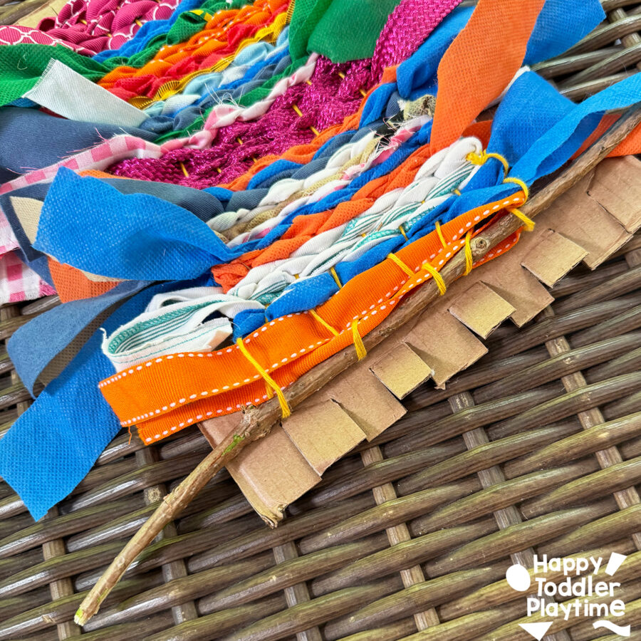 How to Make a DIY Cardboard Weaving Loom - Happy Toddler Playtime